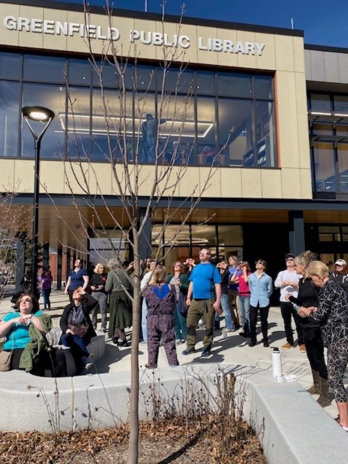 Large crowd enjoys eclipse watch party at Greenfield Public Library ...